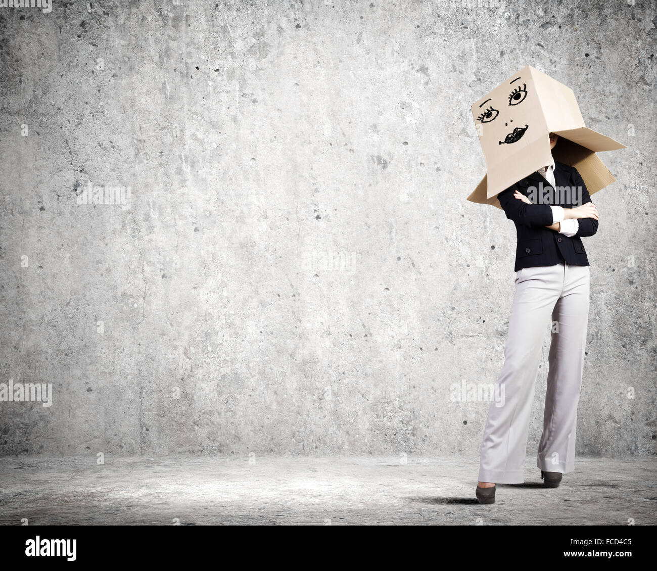 Confident businesswoman wearing carton box on head Stock Photo - Alamy