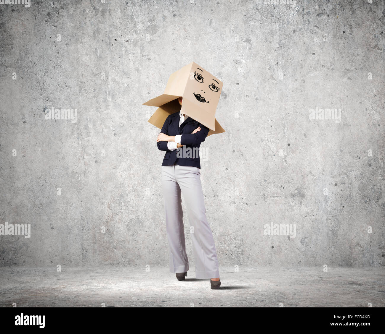 Confident businesswoman wearing carton box on head Stock Photo - Alamy