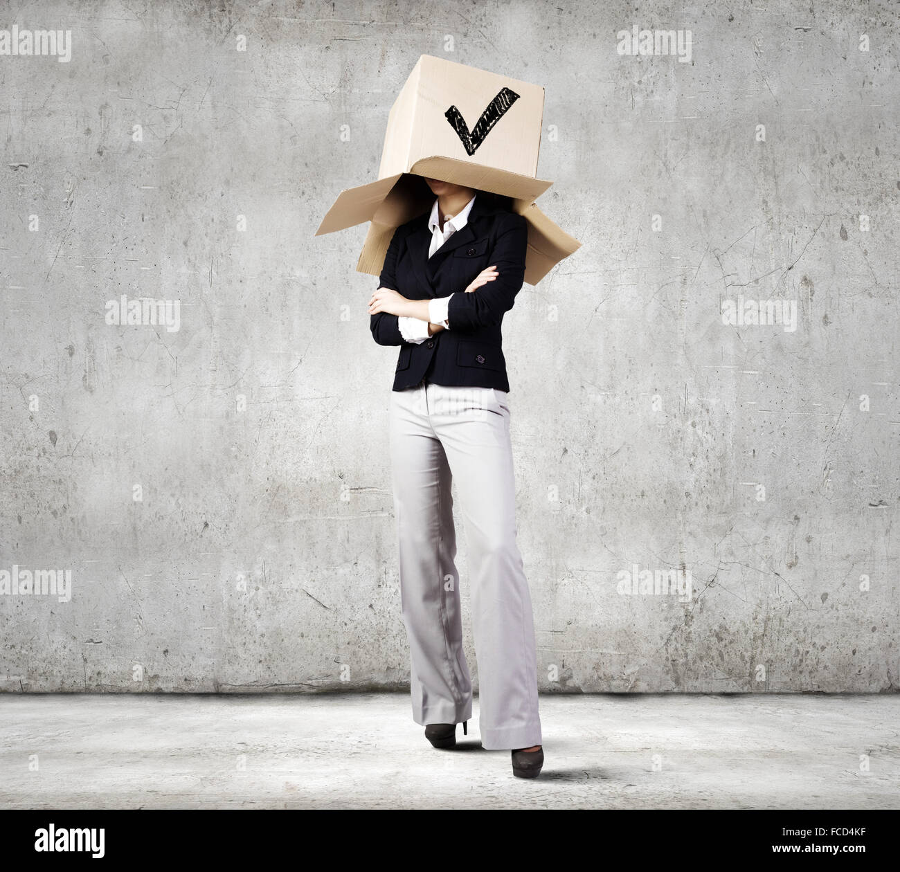 Confident businesswoman wearing carton box on head Stock Photo - Alamy