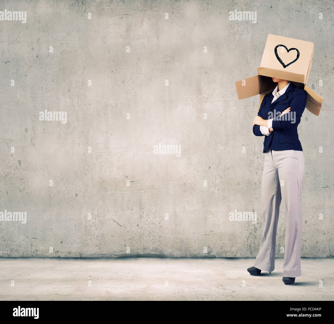 Confident businesswoman wearing carton box on head Stock Photo - Alamy