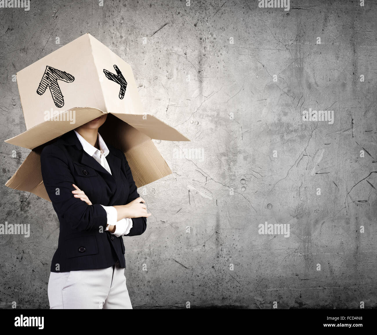 Businesswoman wearing carton box with drawings on head Stock Photo - Alamy