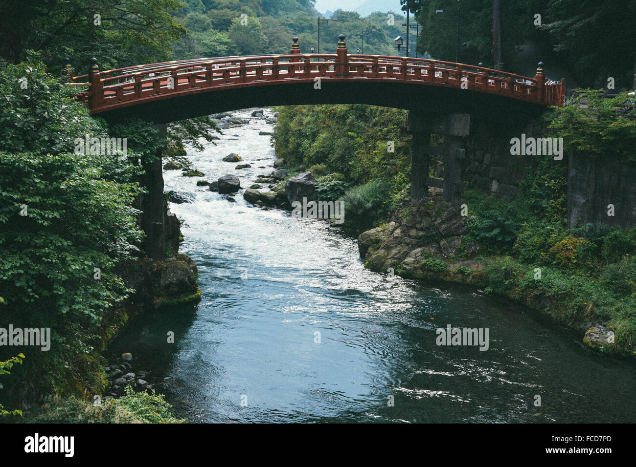 Bridge Over Flowing River Stock Photo - Alamy