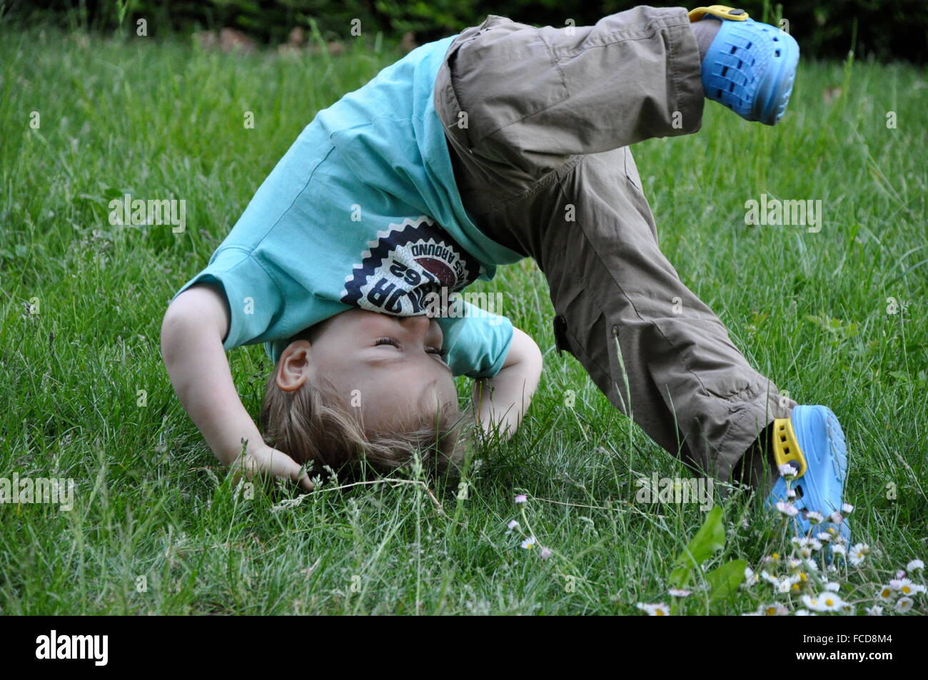 Boy doing headstand hi-res stock photography and images - Alamy