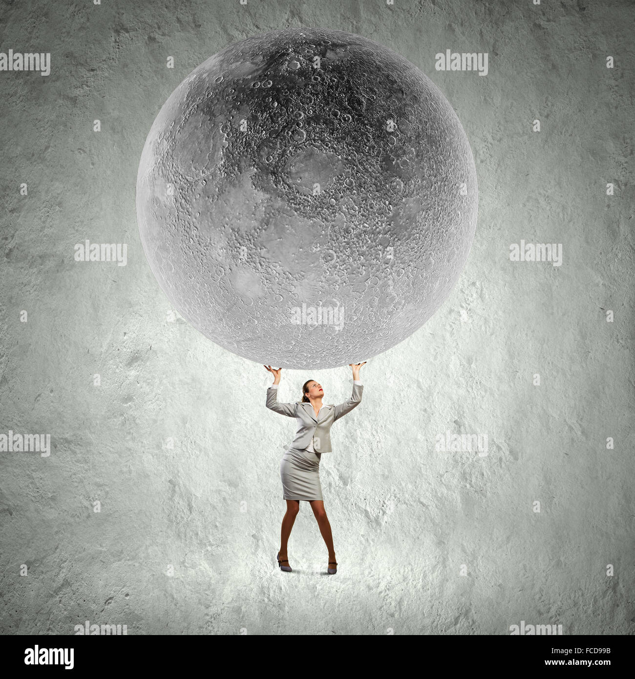 Conceptual image of businesswoman holding huge moon above head Stock ...