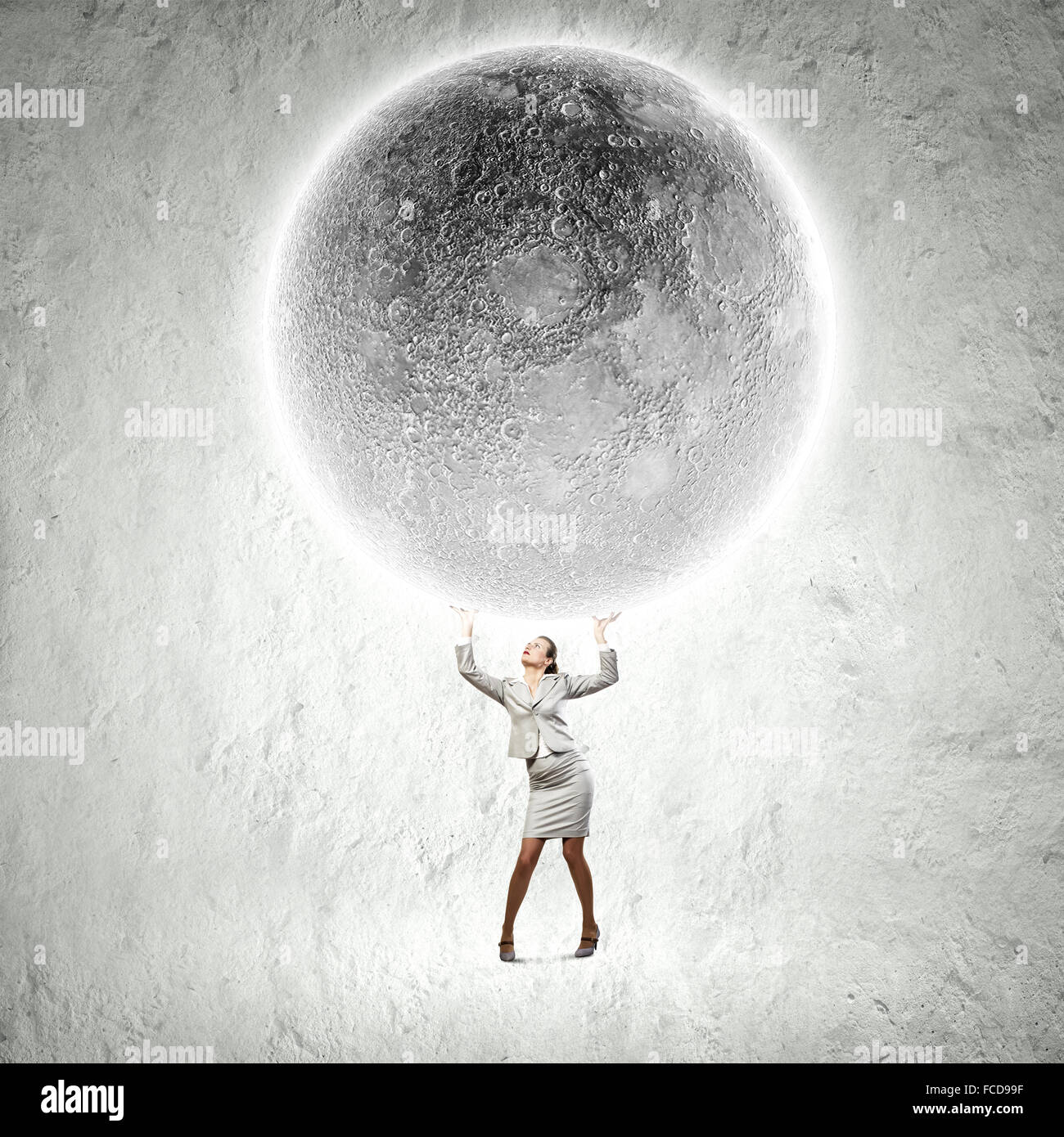 Conceptual image of businesswoman holding huge moon above head Stock ...