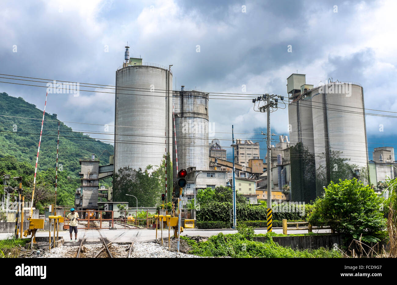 Railroad Tracks Leading To Factory Stock Photo - Alamy