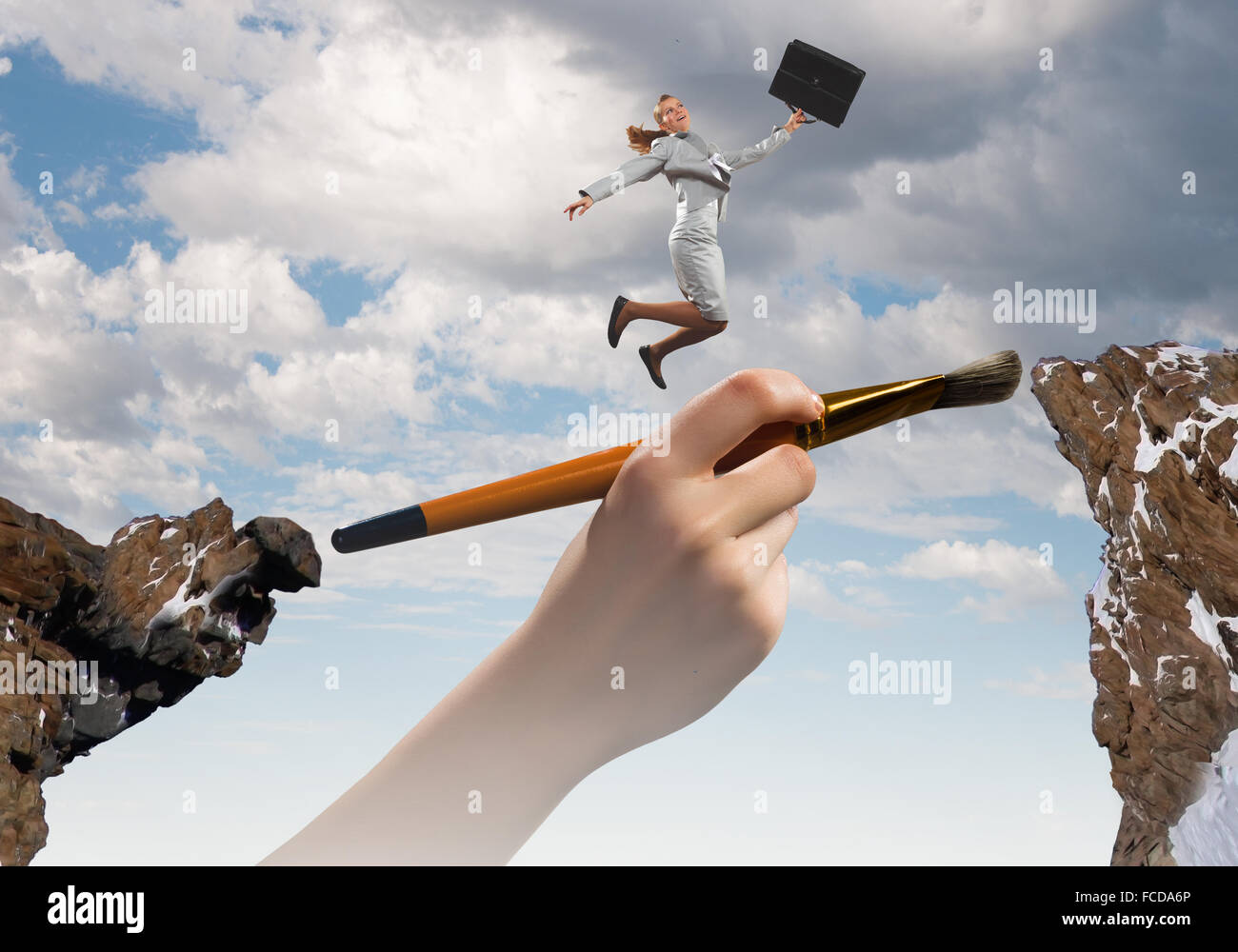 Young businesswoman jumping over gap. Risk concept Stock Photo - Alamy