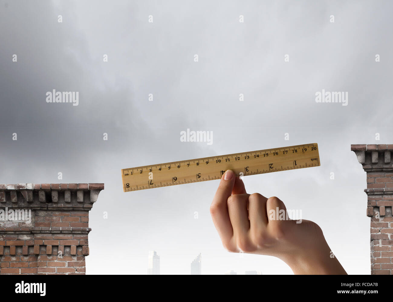 Close up of human hand measuring gap with ruler Stock Photo - Alamy