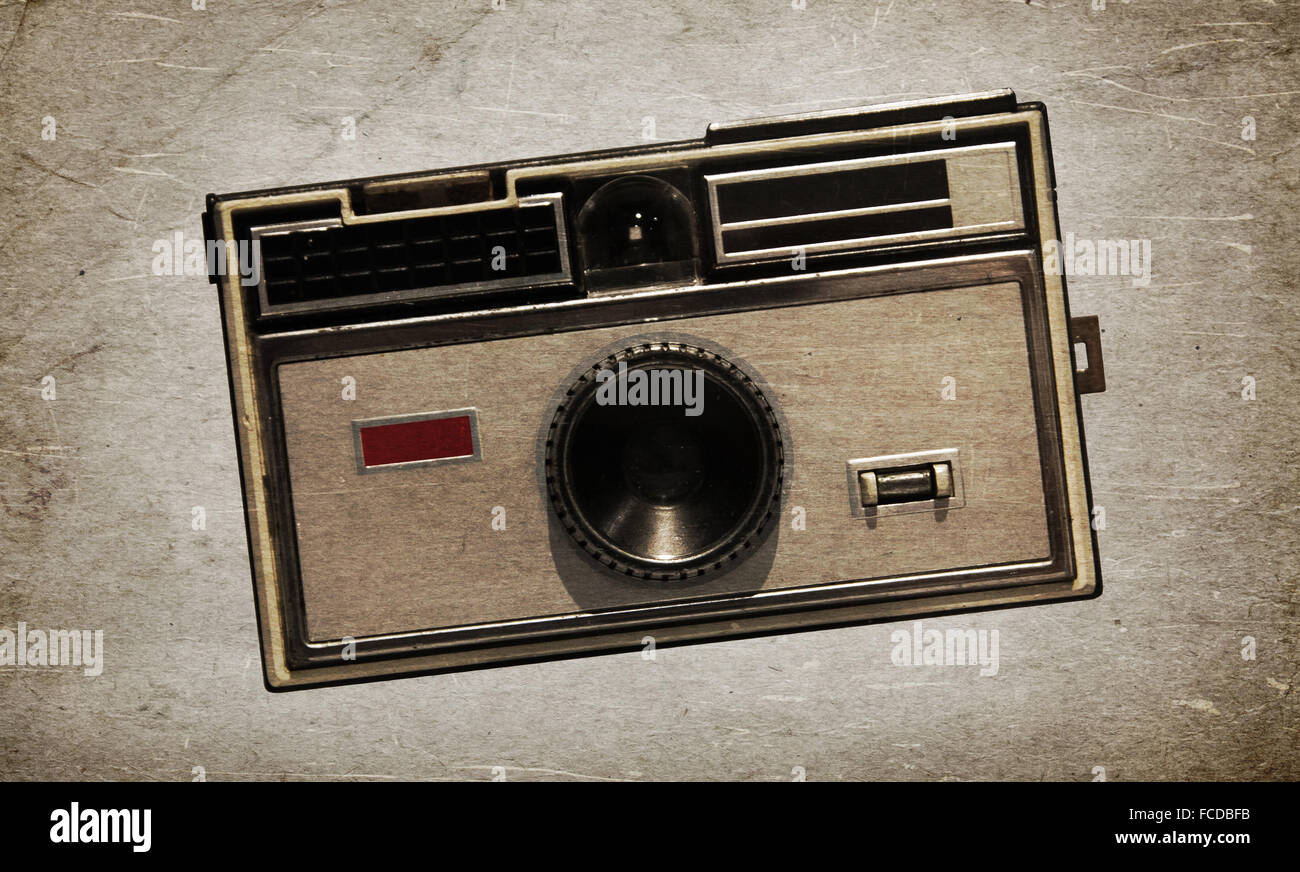 Old camera, isolated on a vintage background Stock Photo - Alamy