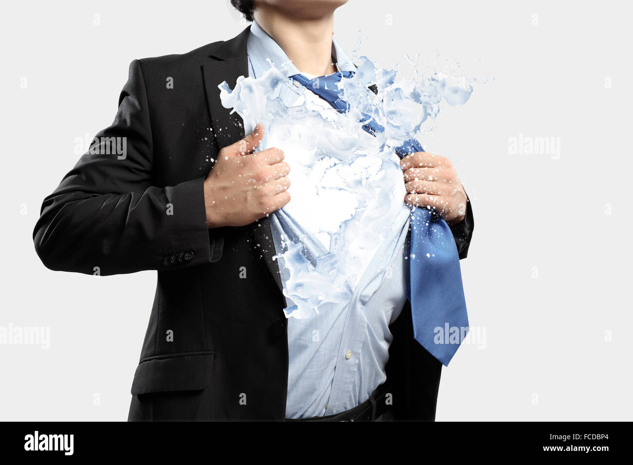 Businessman in suit tearing his shirt on chest Stock Photo - Alamy