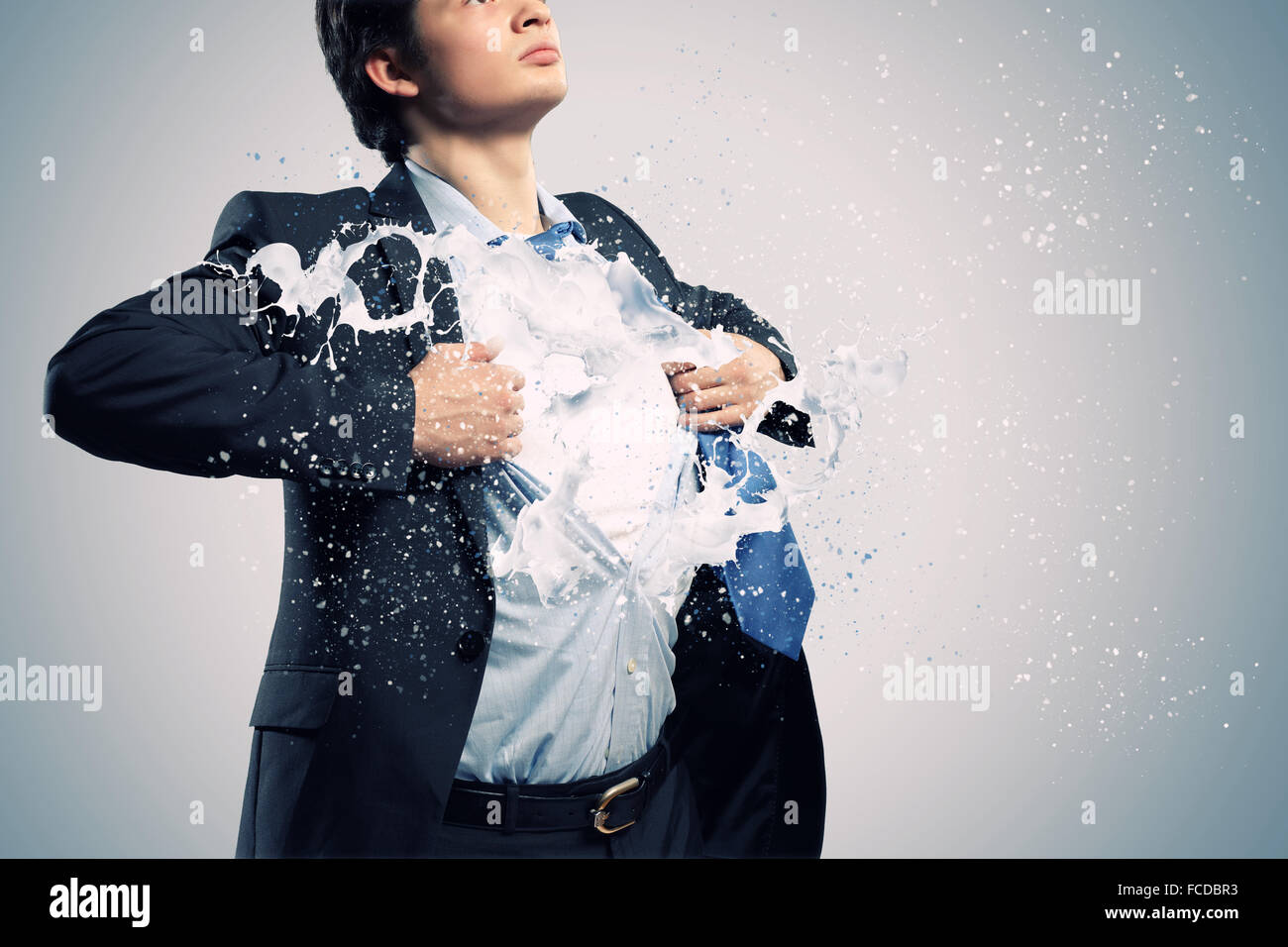 Businessman in suit tearing his shirt on chest Stock Photo - Alamy