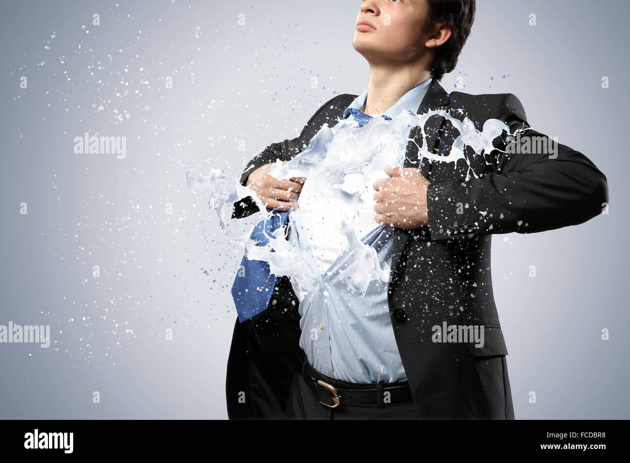 Businessman in suit tearing his shirt on chest Stock Photo - Alamy