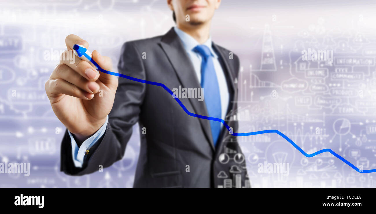 Close up of businessman drawing increasing graph Stock Photo - Alamy