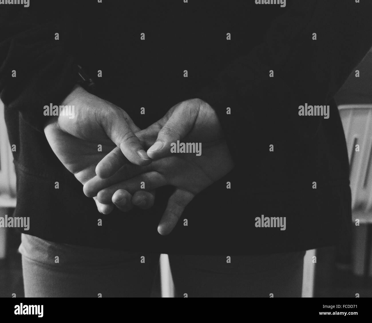 Midsection Of Man With Hands Behind Back Stock Photo - Alamy