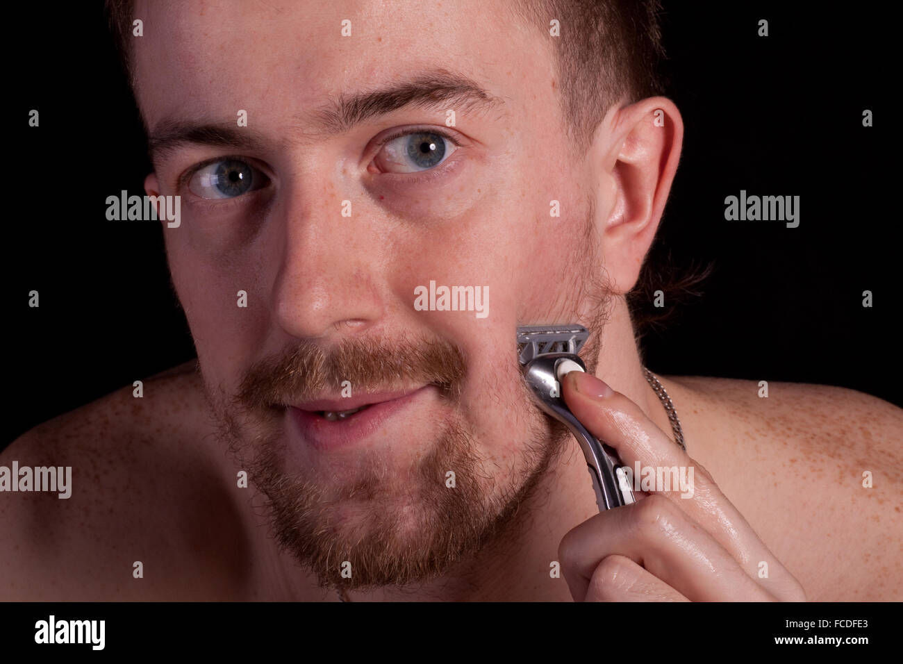 Men shaving faces. Close-up Stock Photo - Alamy