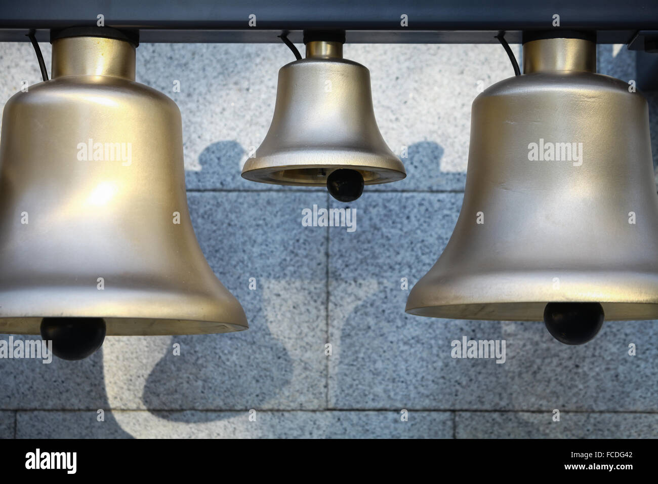 Color image of some various sized bells in a row Stock Photo - Alamy