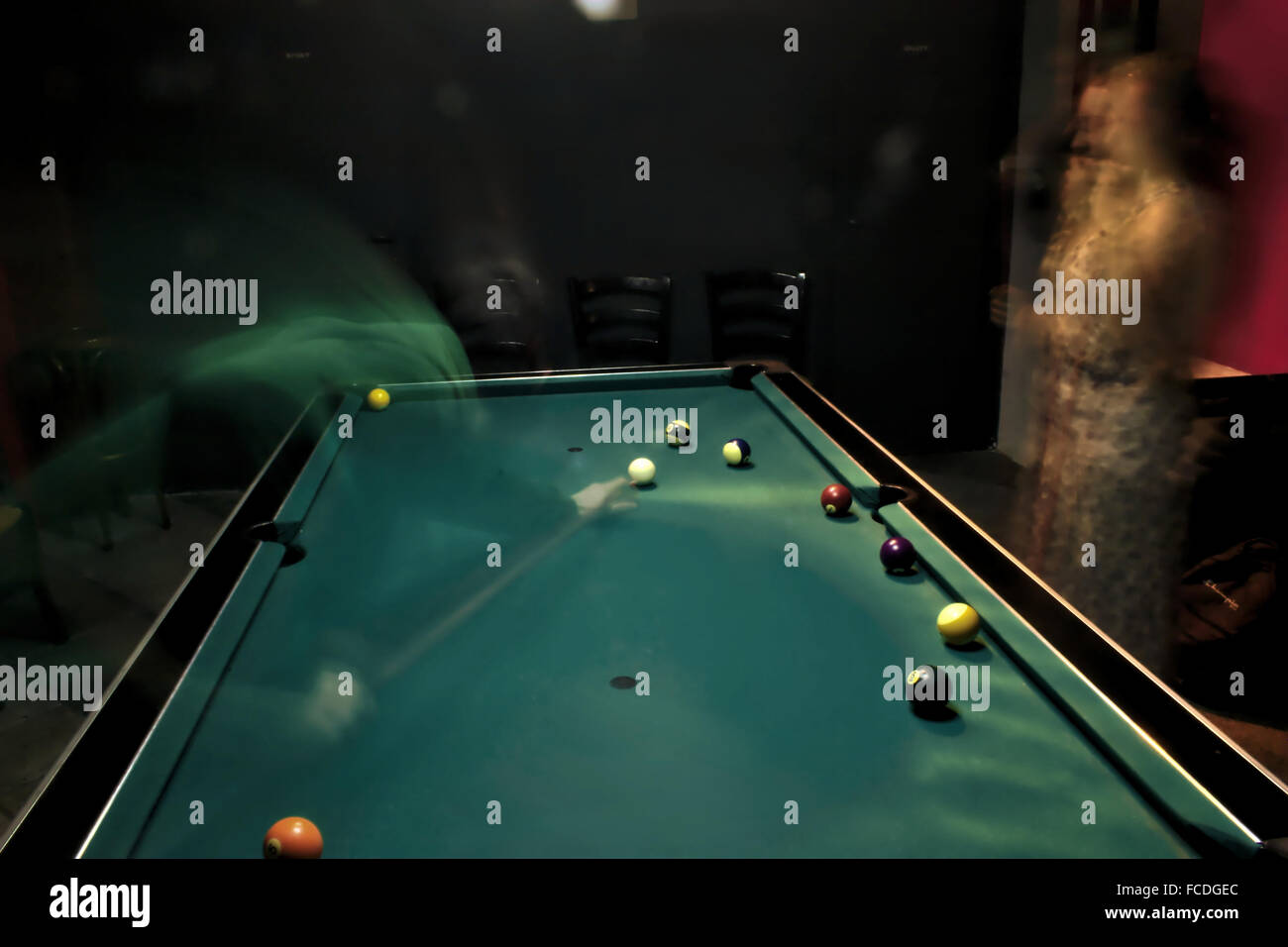 Two women shooting pool hi-res stock photography and images - Alamy