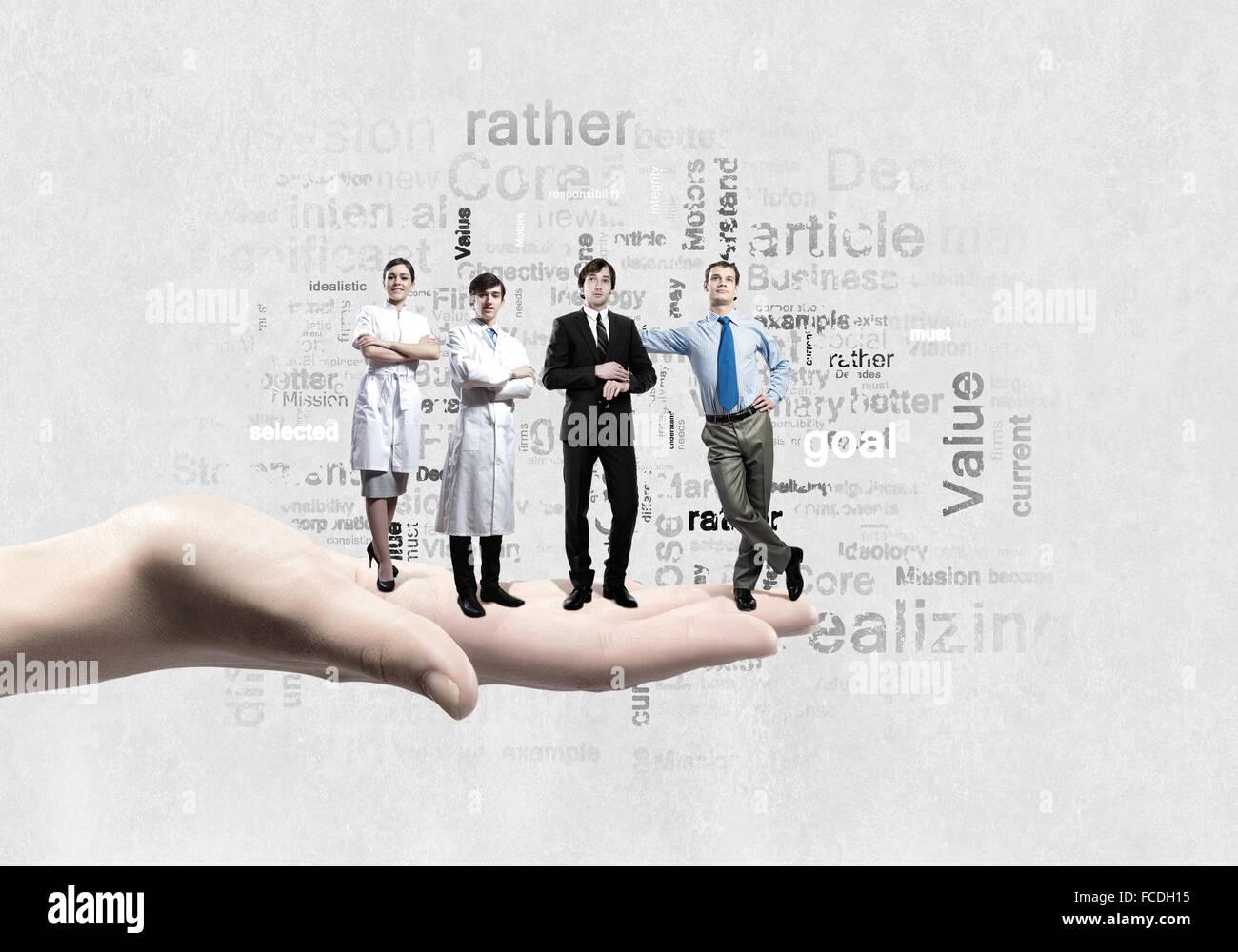 Business people of different professions standing on palm hi-res stock ...