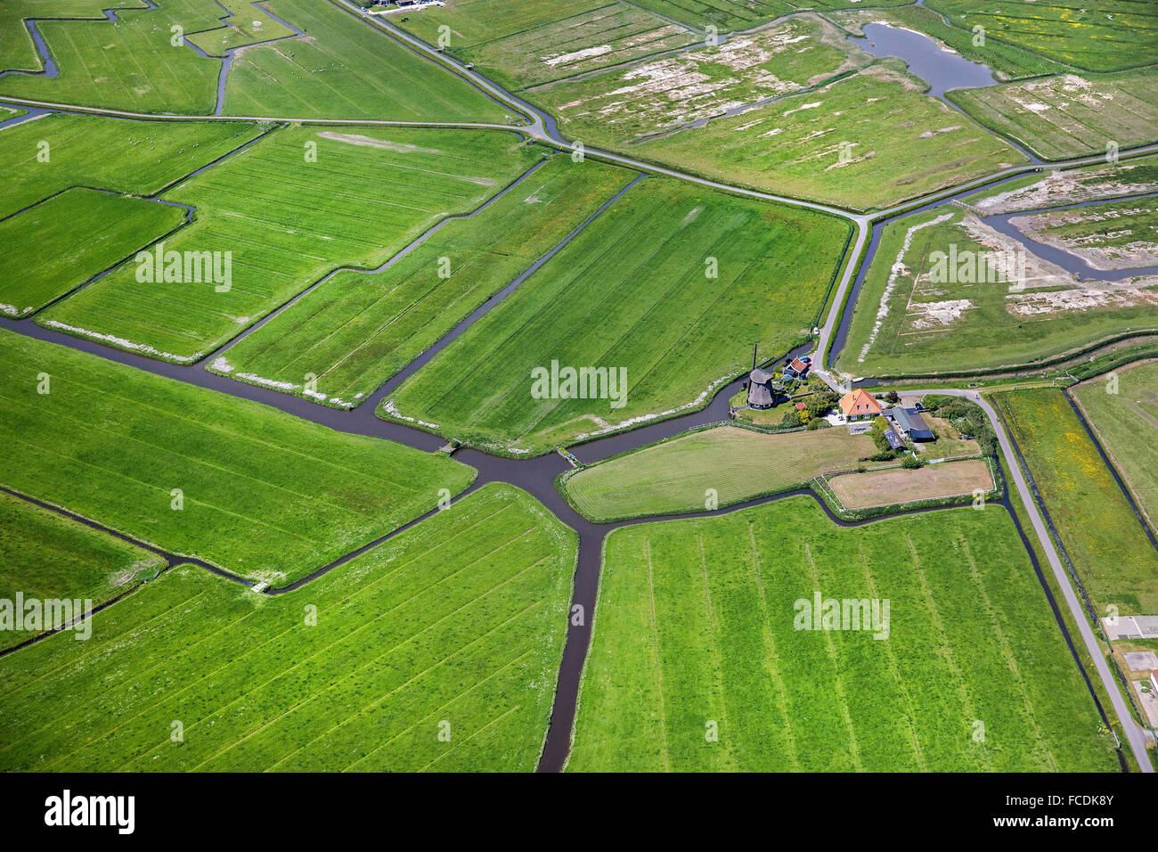 Netherlands, Petten, Pettemer Polder. Windmill and farm. Aerial Stock ...