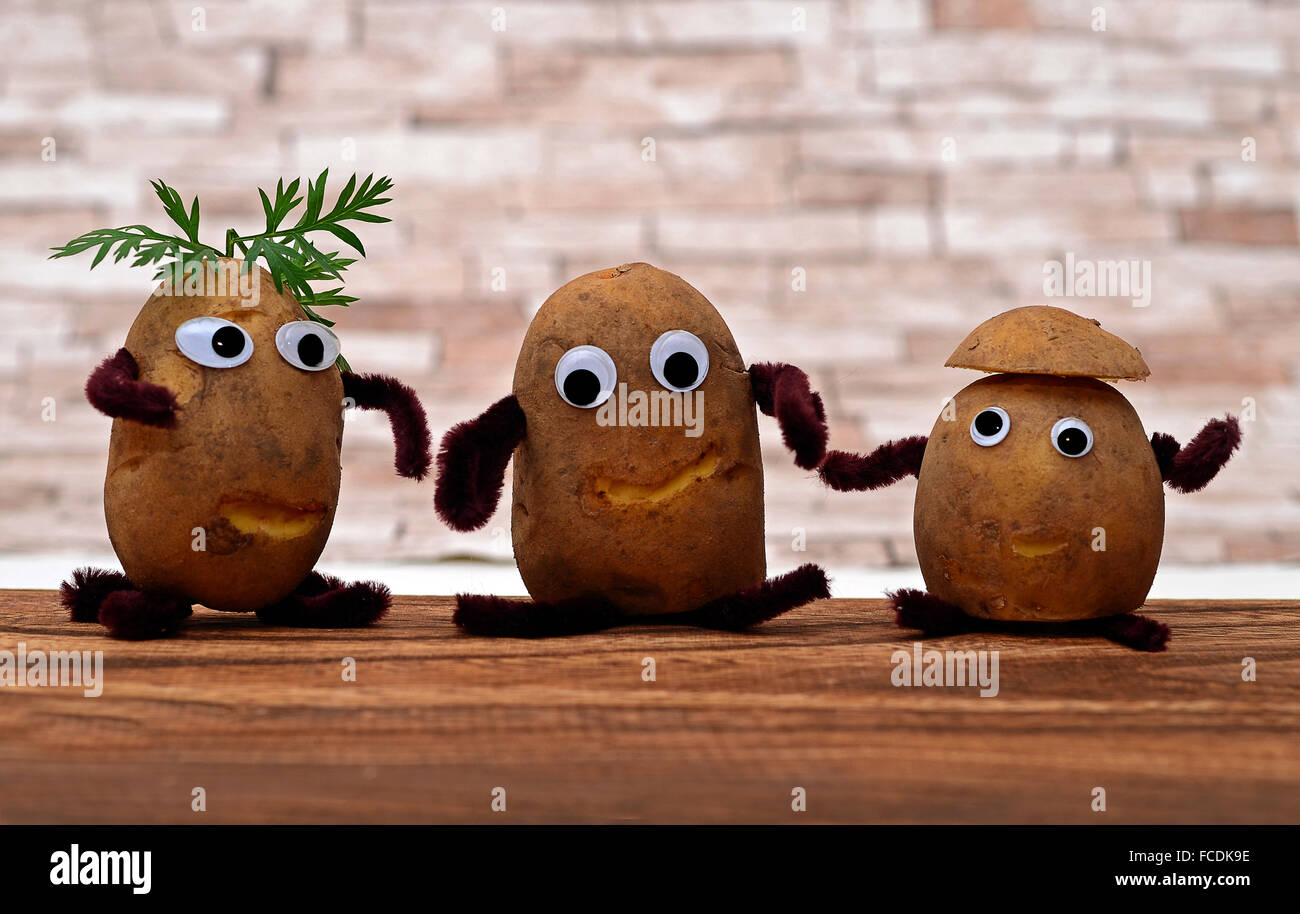 Three potatoes with faces, symbolic picture for healthy eating Stock ...