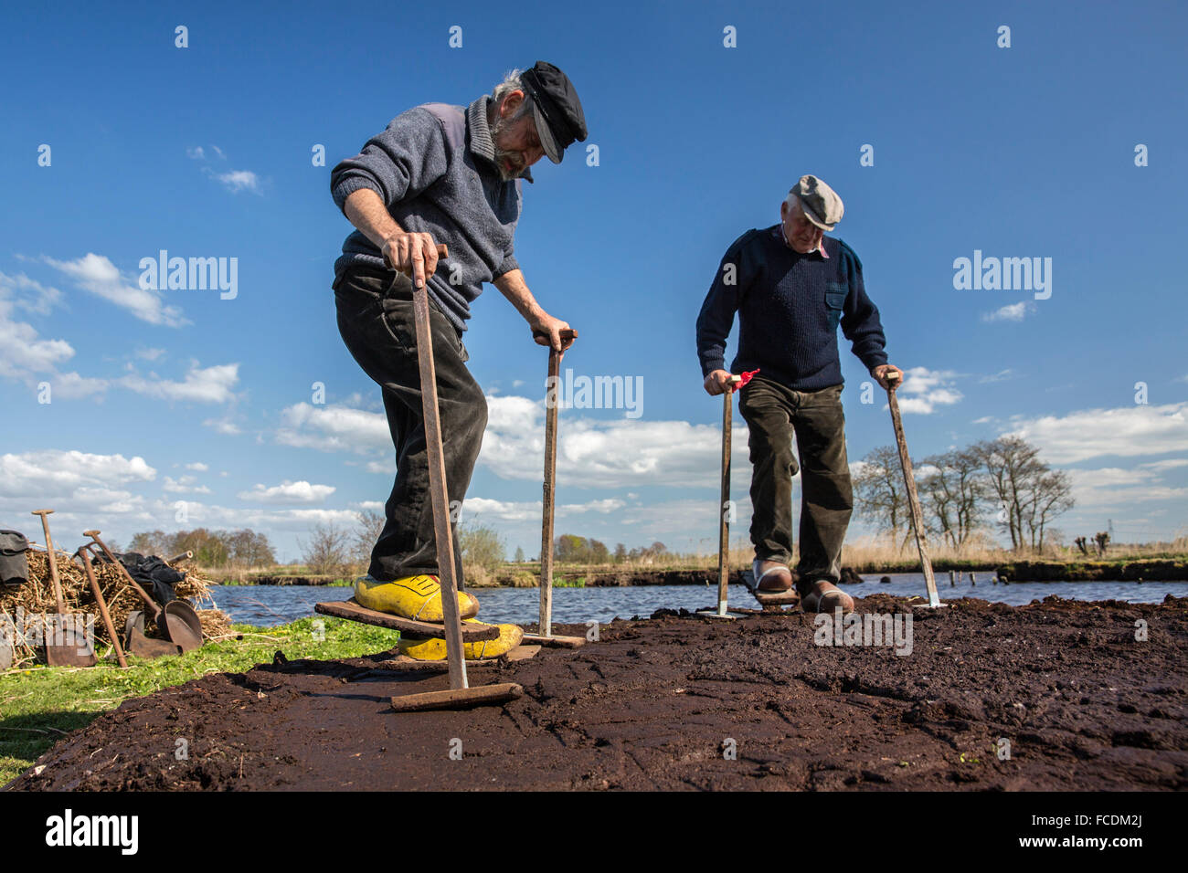 Netherlands, Reeuwijk, Oukoopse Polder, Peat dredgers. Drying peat ...