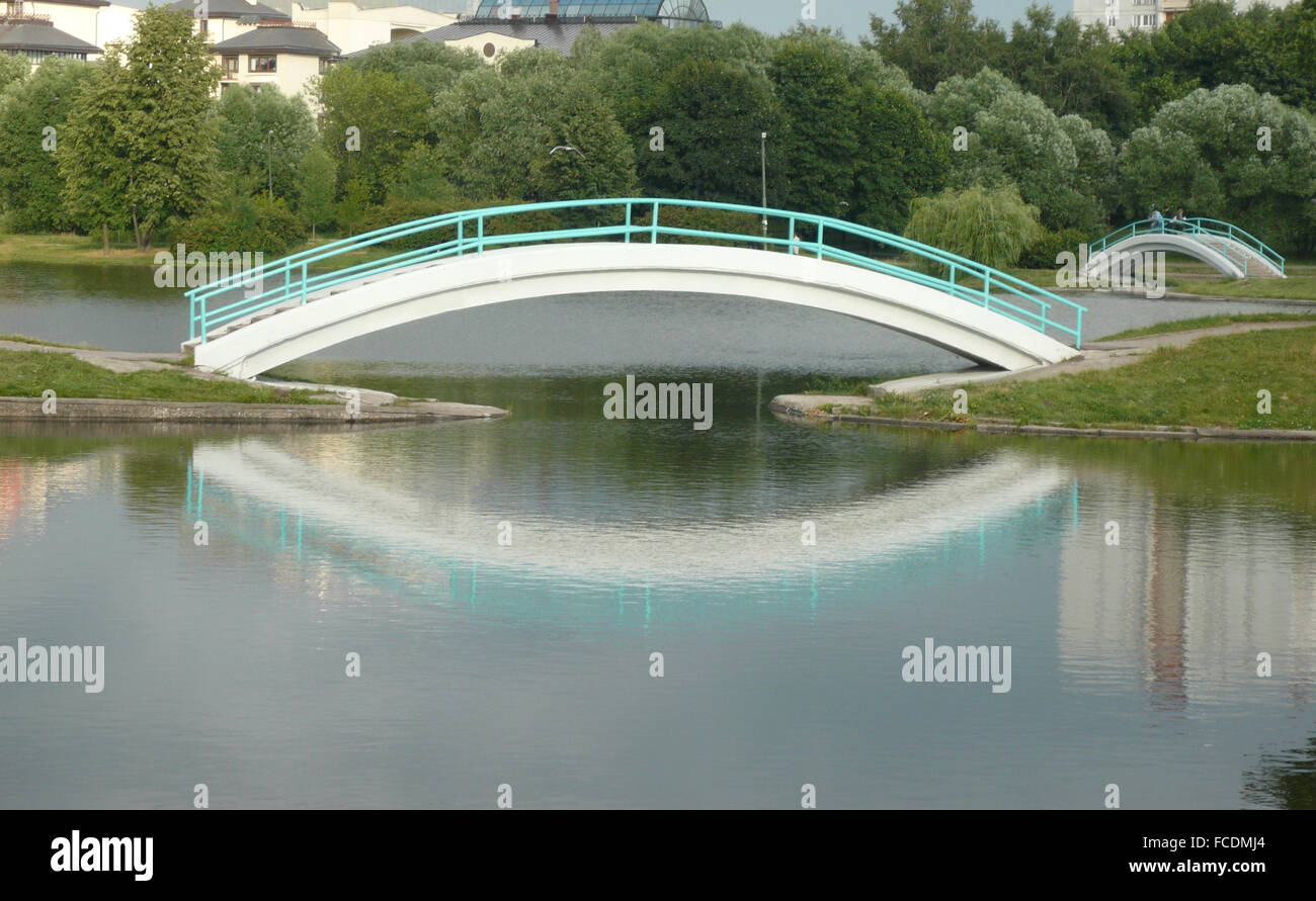 bridge over pond in city park Stock Photo - Alamy