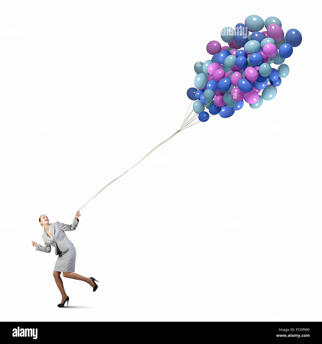 Young businesswoman running with bunch of colorful balloons Stock Photo ...