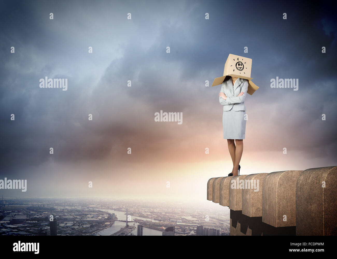Businesswoman in suit wearing carton box on head Stock Photo - Alamy