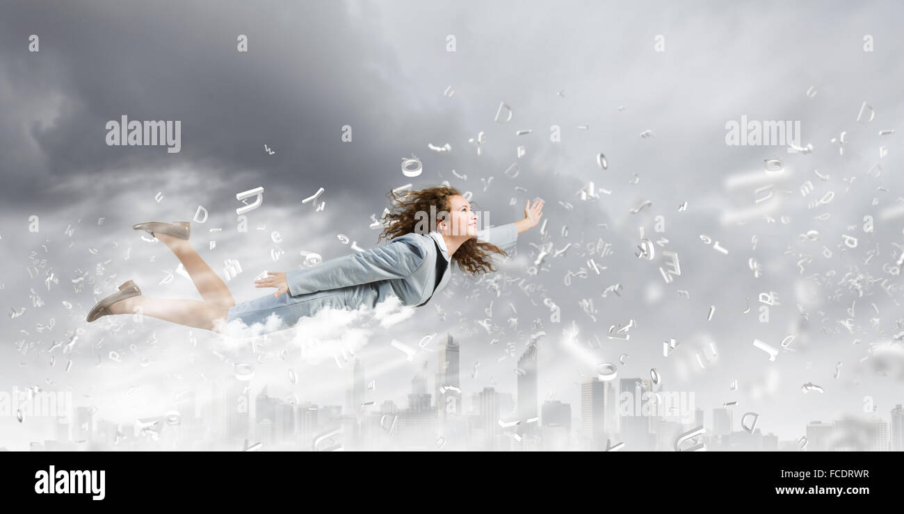 Young happy businesswoman flying high in sky Stock Photo - Alamy