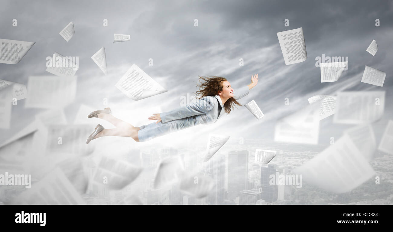 Young happy businesswoman flying high in sky Stock Photo - Alamy