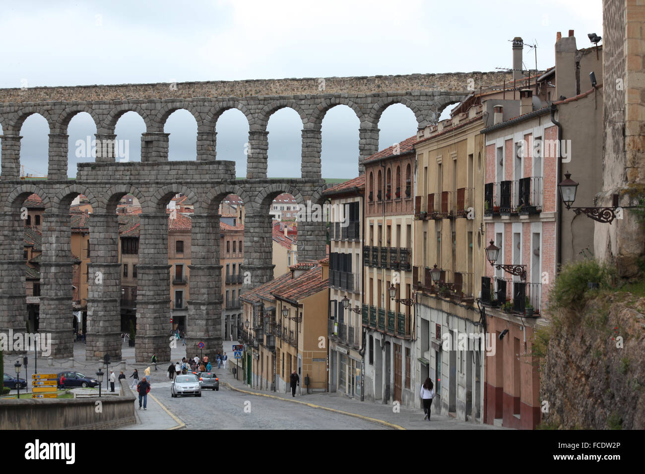 Group Of People In Front Of Arched Structure Stock Photo - Alamy