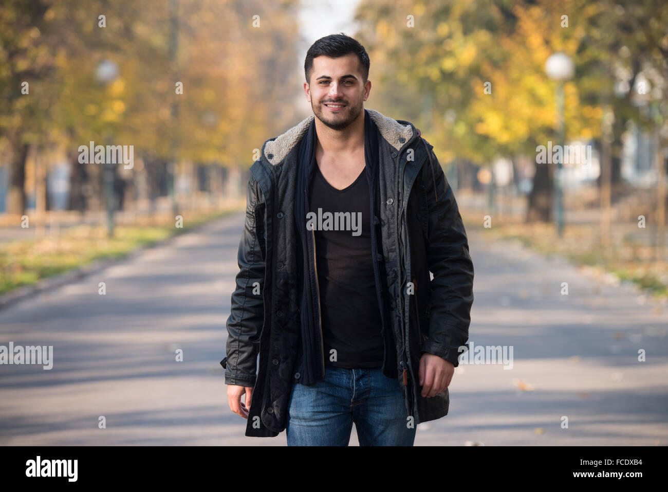 Young Man Walking In Forest Through The Woods Outside During Autumn ...