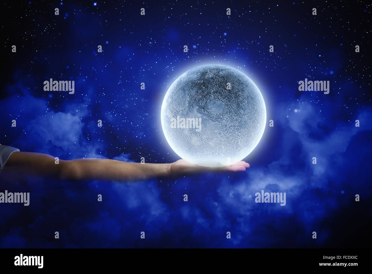 Close up of human hand touching moon planet Stock Photo - Alamy