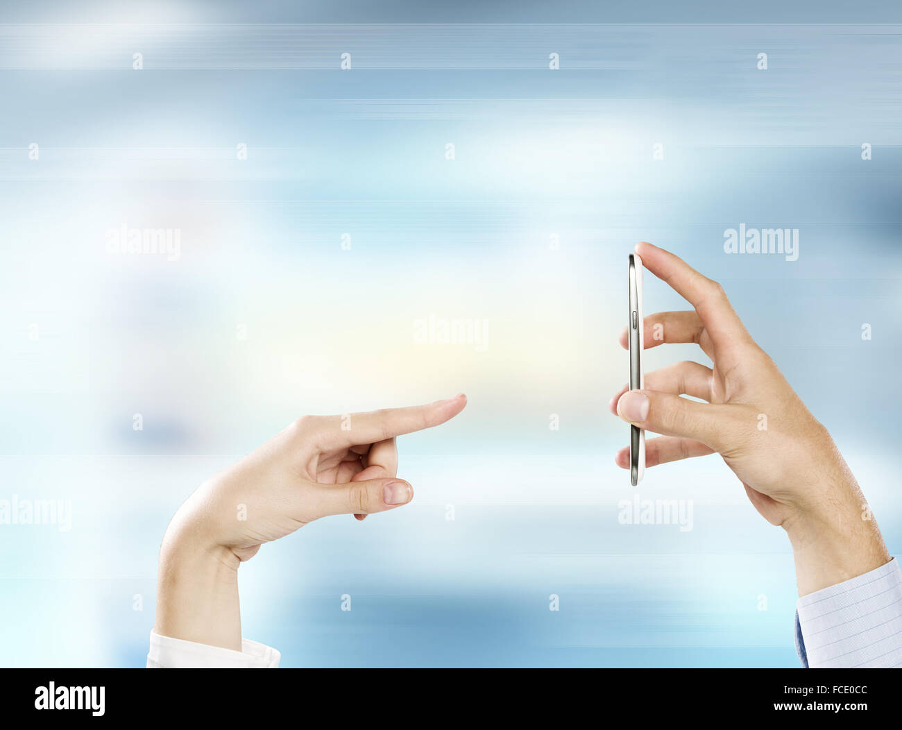Two business people using one mobile phone at the same time Stock Photo ...