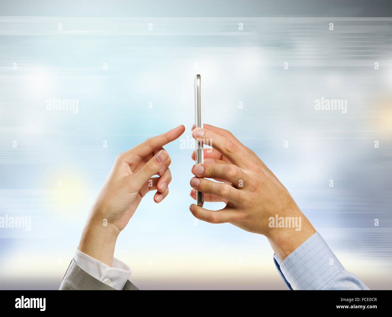 Two business people using one mobile phone at the same time Stock Photo ...