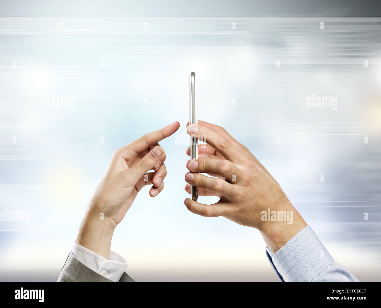 Two business people using one mobile phone at the same time Stock Photo ...