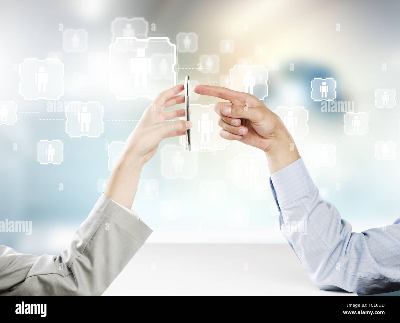 Two business people using one mobile phone at the same time Stock Photo ...