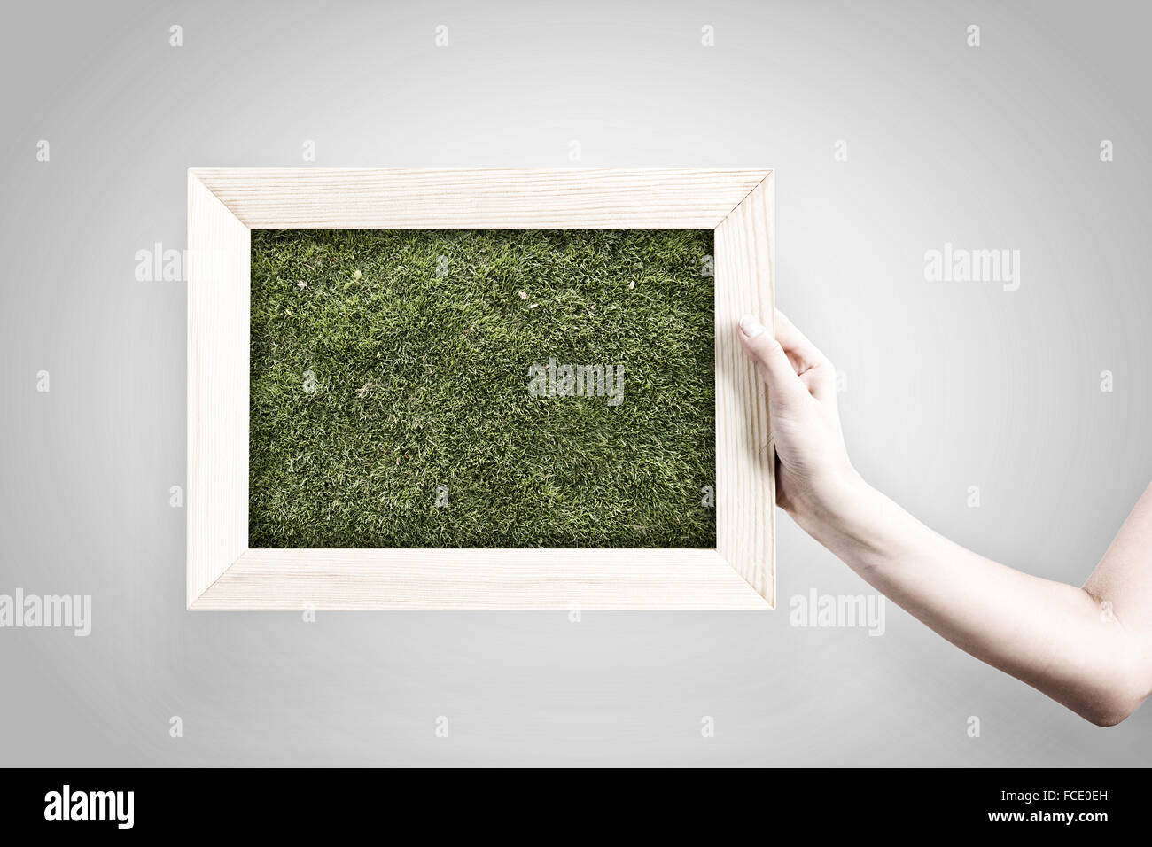 Close up of human hand holding frame Stock Photo - Alamy