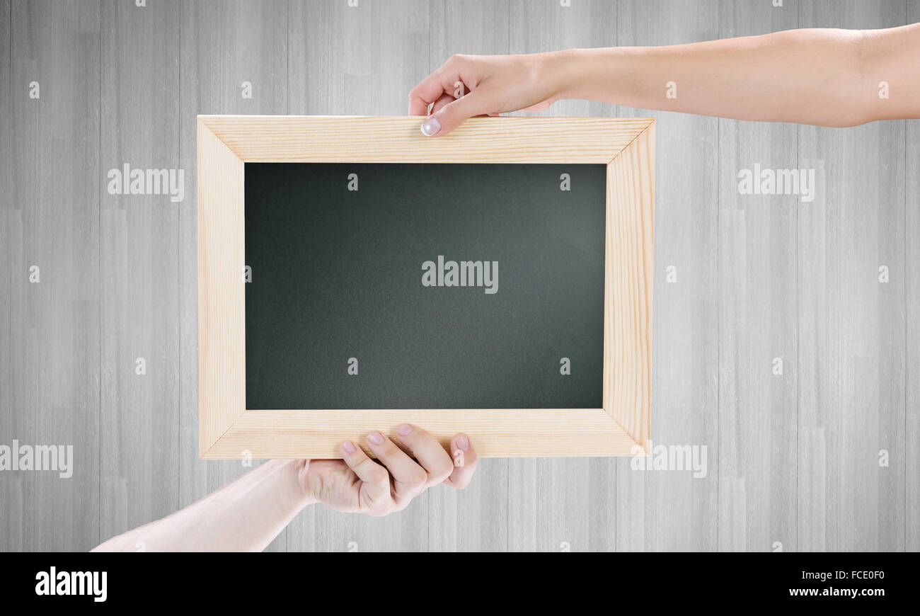 Close up of human hands holding blank frame Stock Photo - Alamy