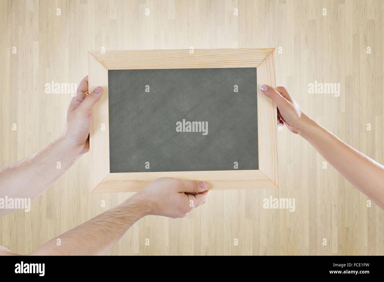 Close up of human hands holding blank frame Stock Photo - Alamy