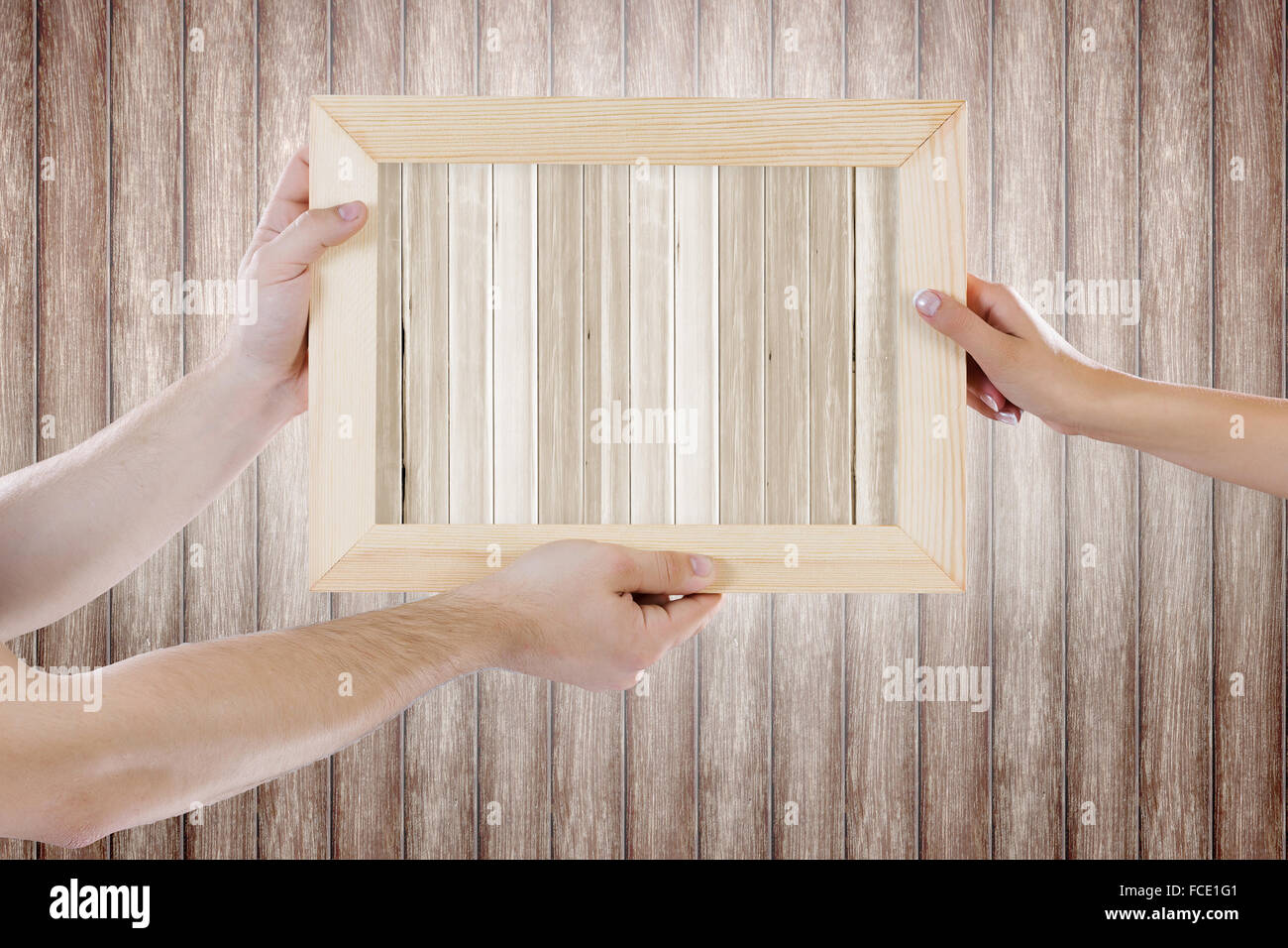 Close up of human hands holding blank frame Stock Photo - Alamy