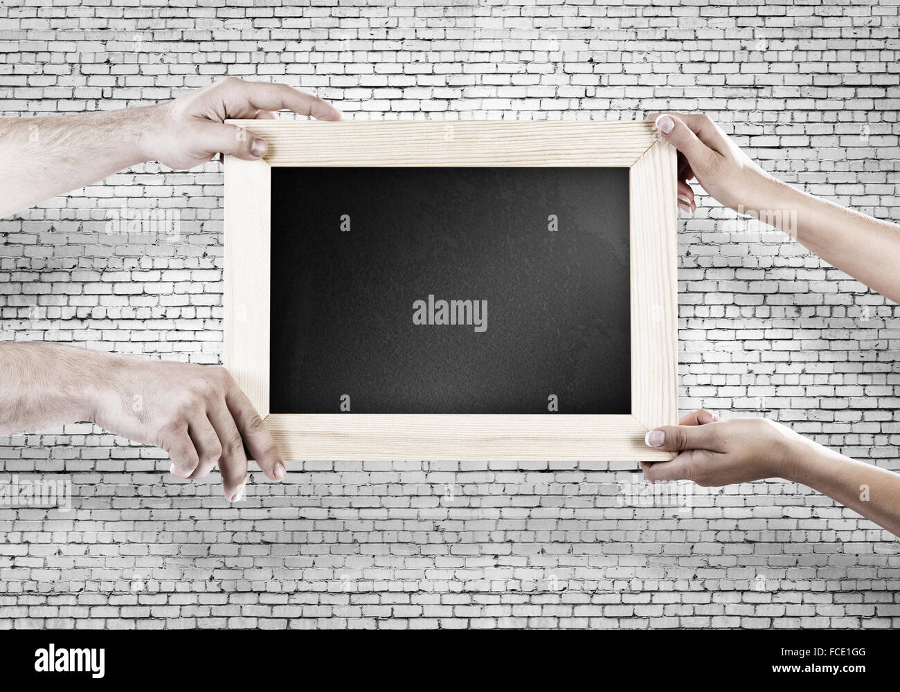 Close up of human hands holding blank frame Stock Photo - Alamy