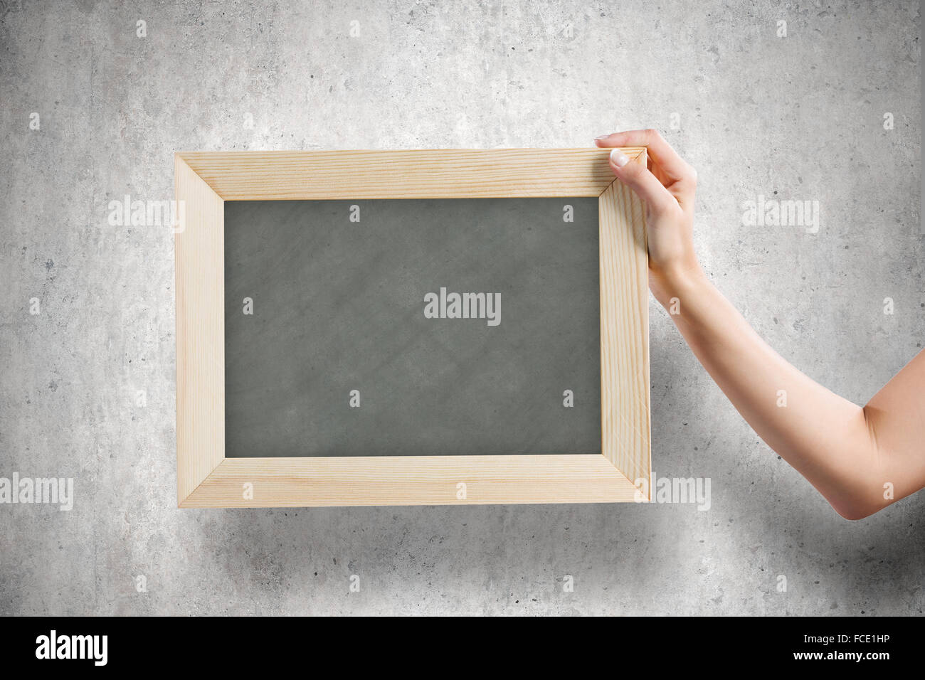 Close up of human hands holding blank frame Stock Photo - Alamy
