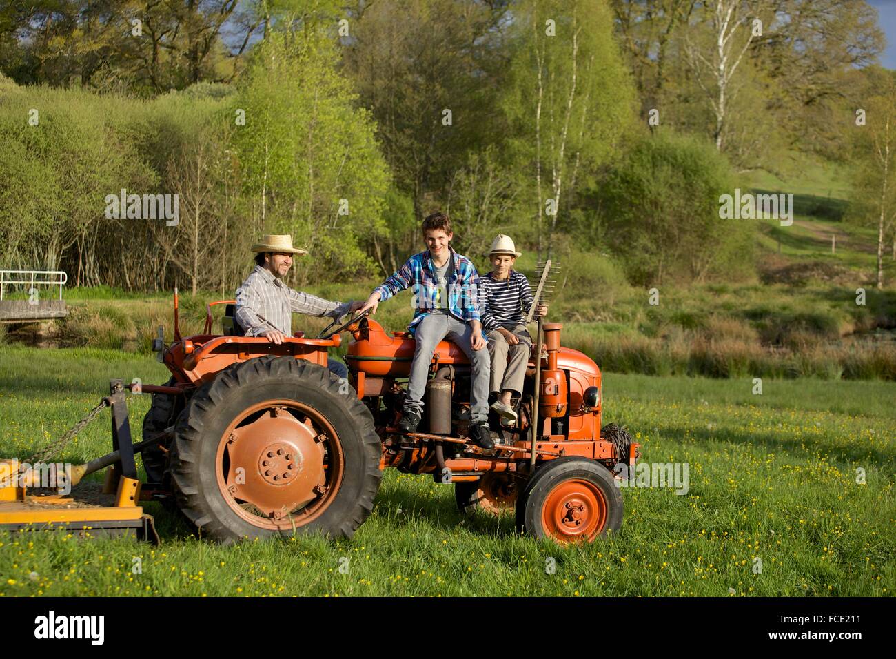 Family on a tractor Stock Photo - Alamy