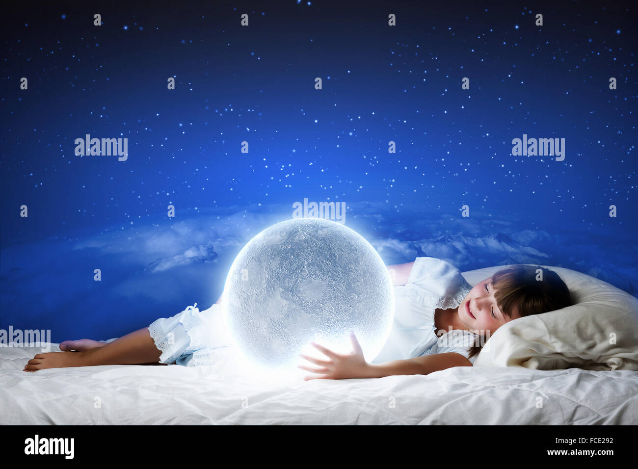 Cute girl sleeping in bed with moon Stock Photo - Alamy