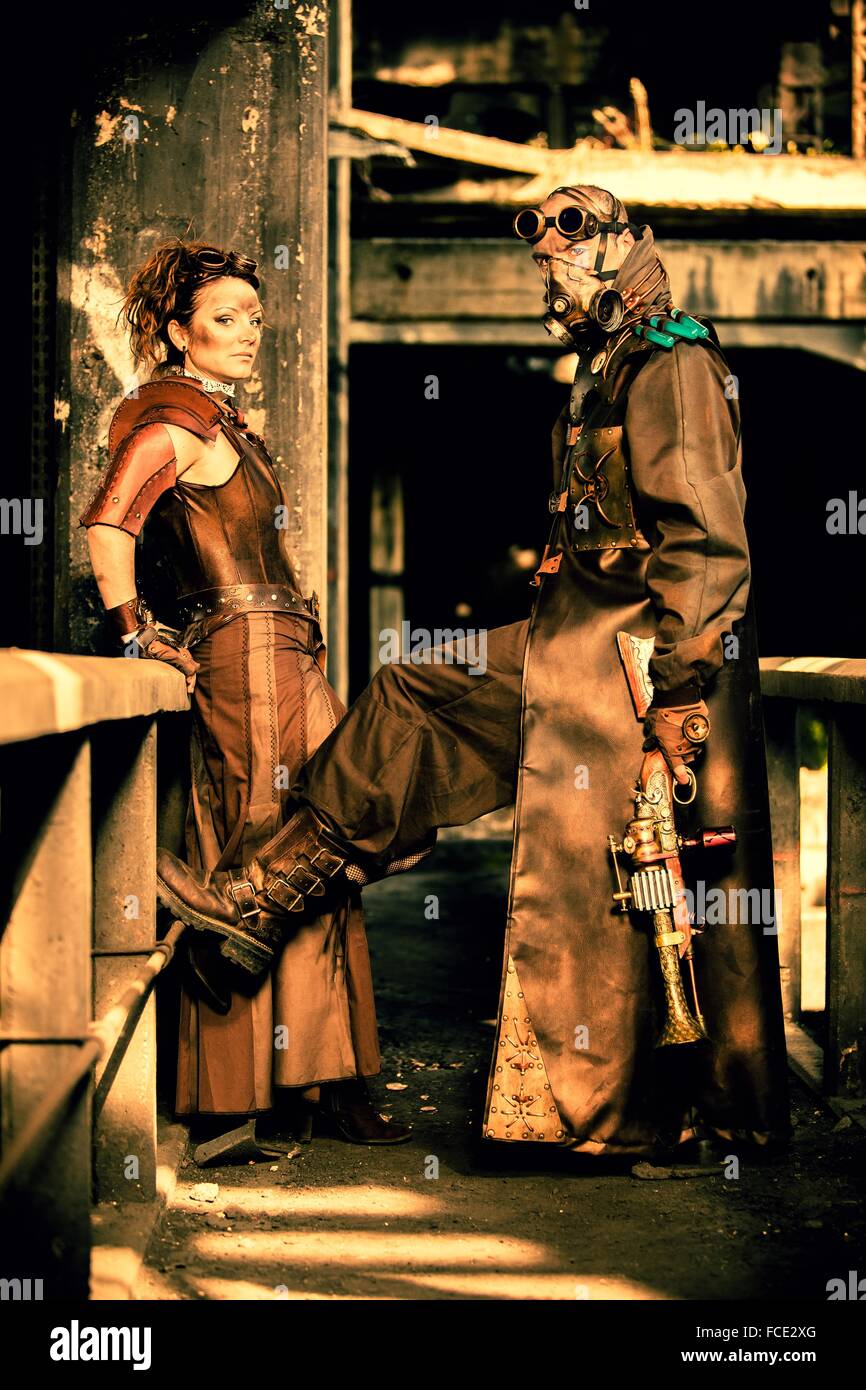 Armed steampunk couple Stock Photo - Alamy