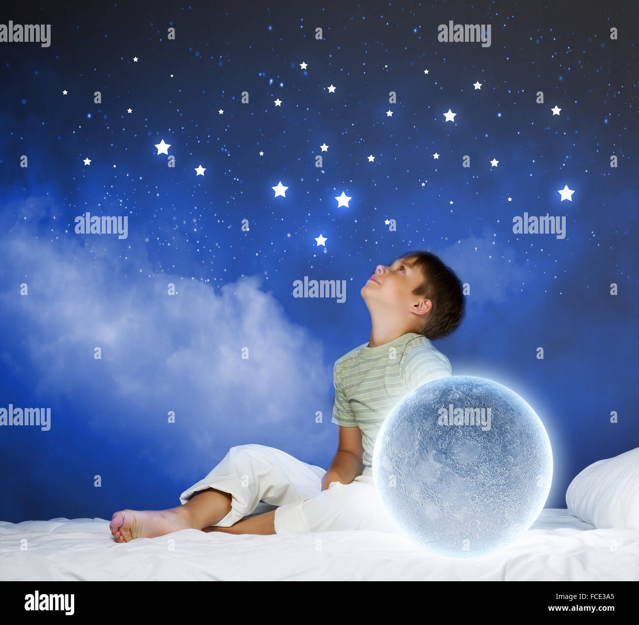 Cute boy sleeping in bed with moon Stock Photo - Alamy