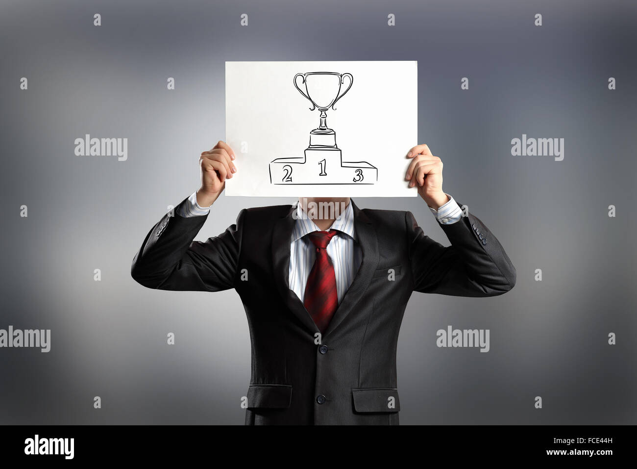 Businessman hiding his face behind paper with drawing Stock Photo - Alamy