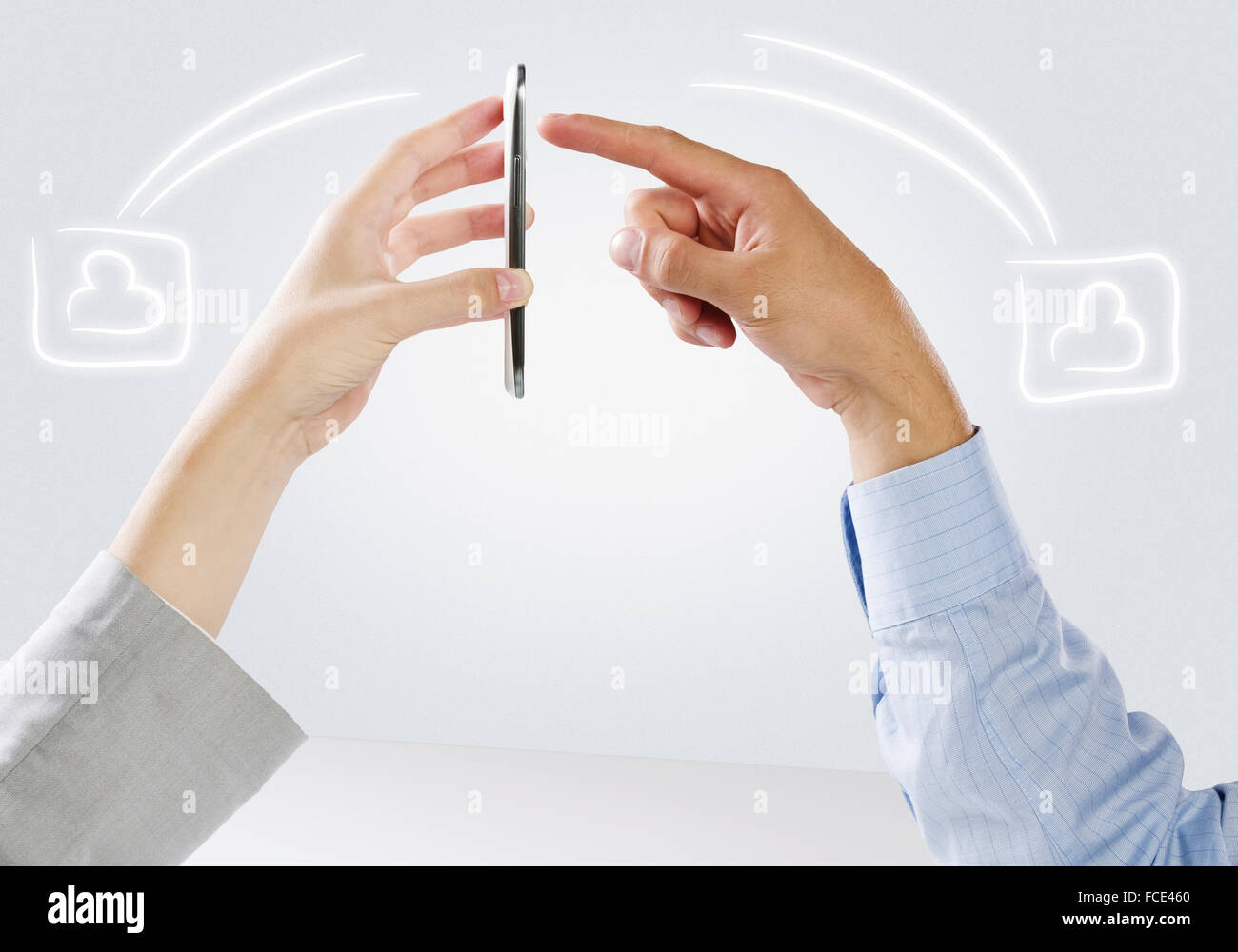 Two business people using one mobile phone at the same time Stock Photo ...
