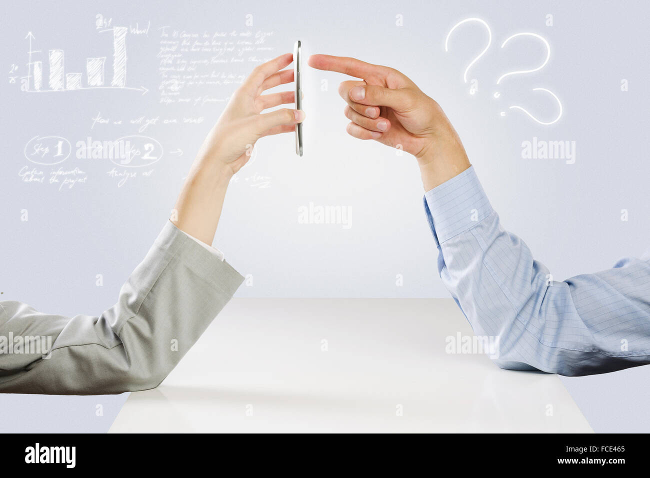 Two business people using one mobile phone at the same time Stock Photo ...